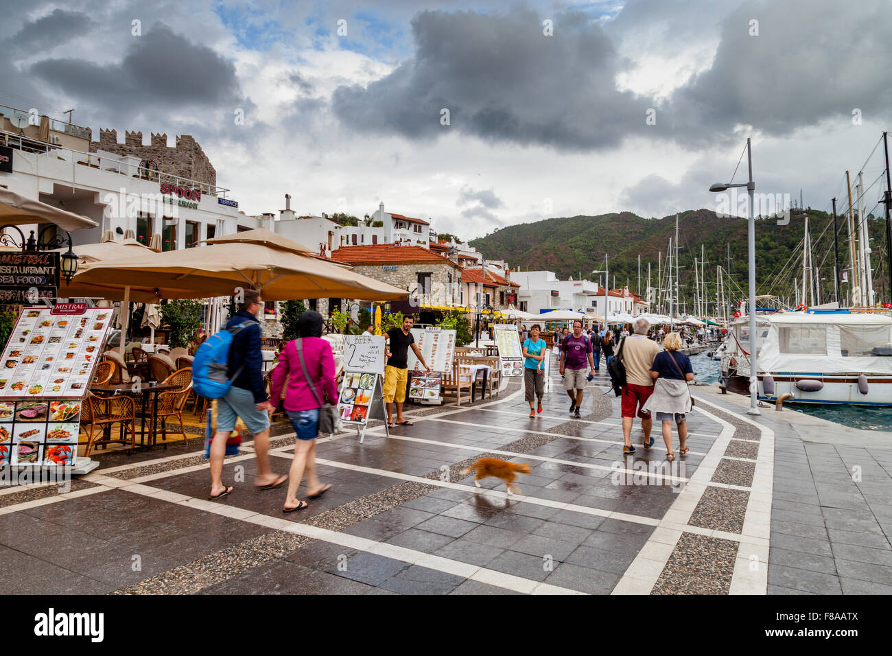 Tourists Walk Along The Seafront In The Rain, Marmaris, Mugla Province ...