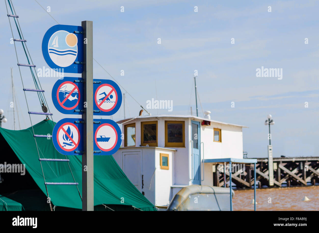 Signpost with safety instructions on a harbor pier Stock Photo - Alamy