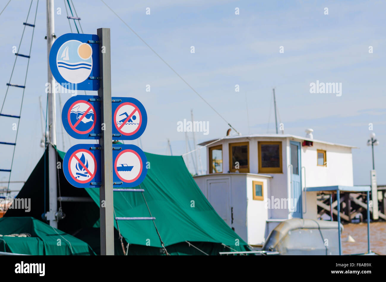 Signpost with safety instructions on a harbor pier Stock Photo - Alamy