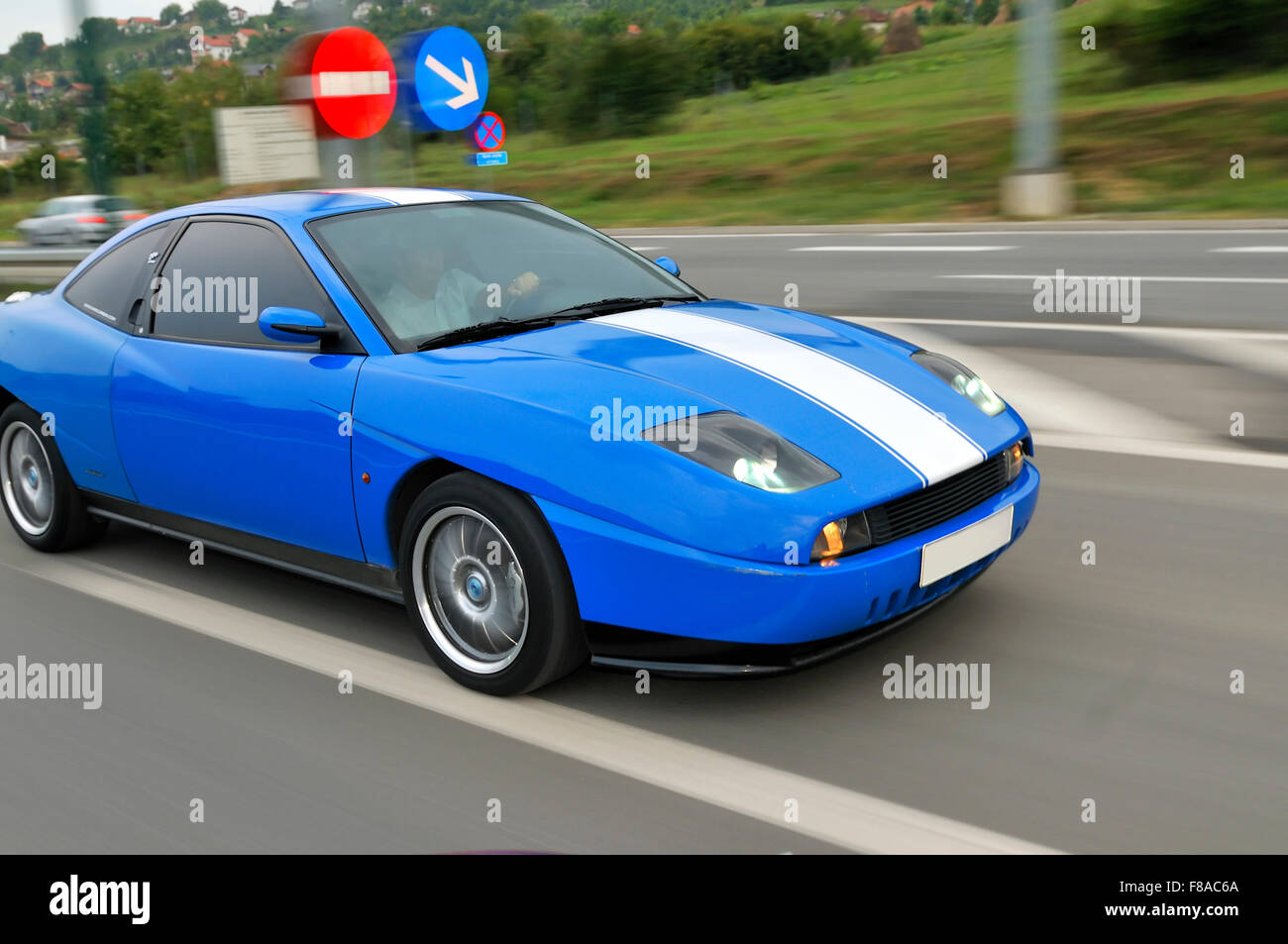 Picutre of tuning cars speeding on highway captured with long exposure ...