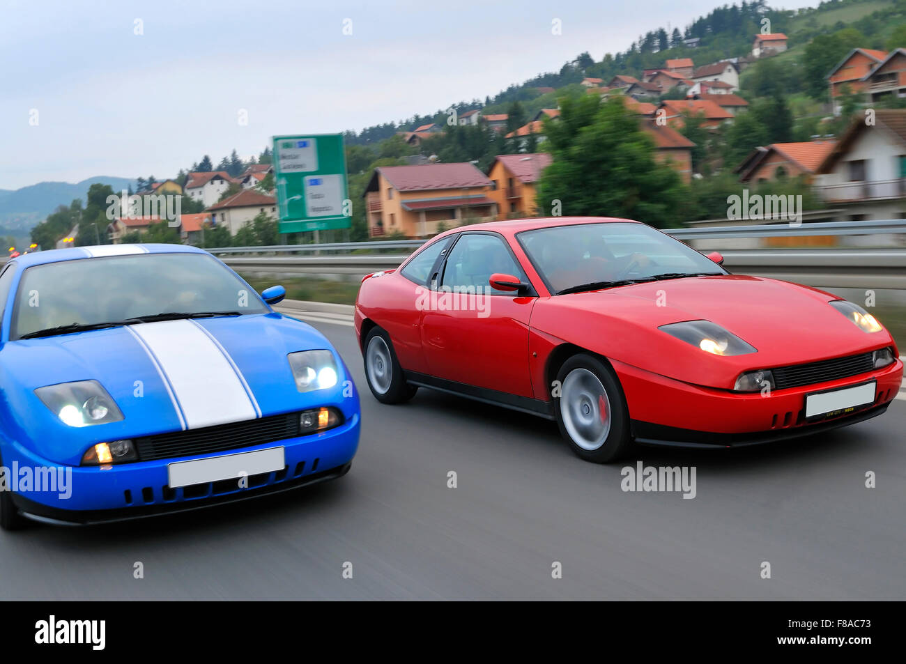 Two hot tuning cars racing Stock Photo - Alamy