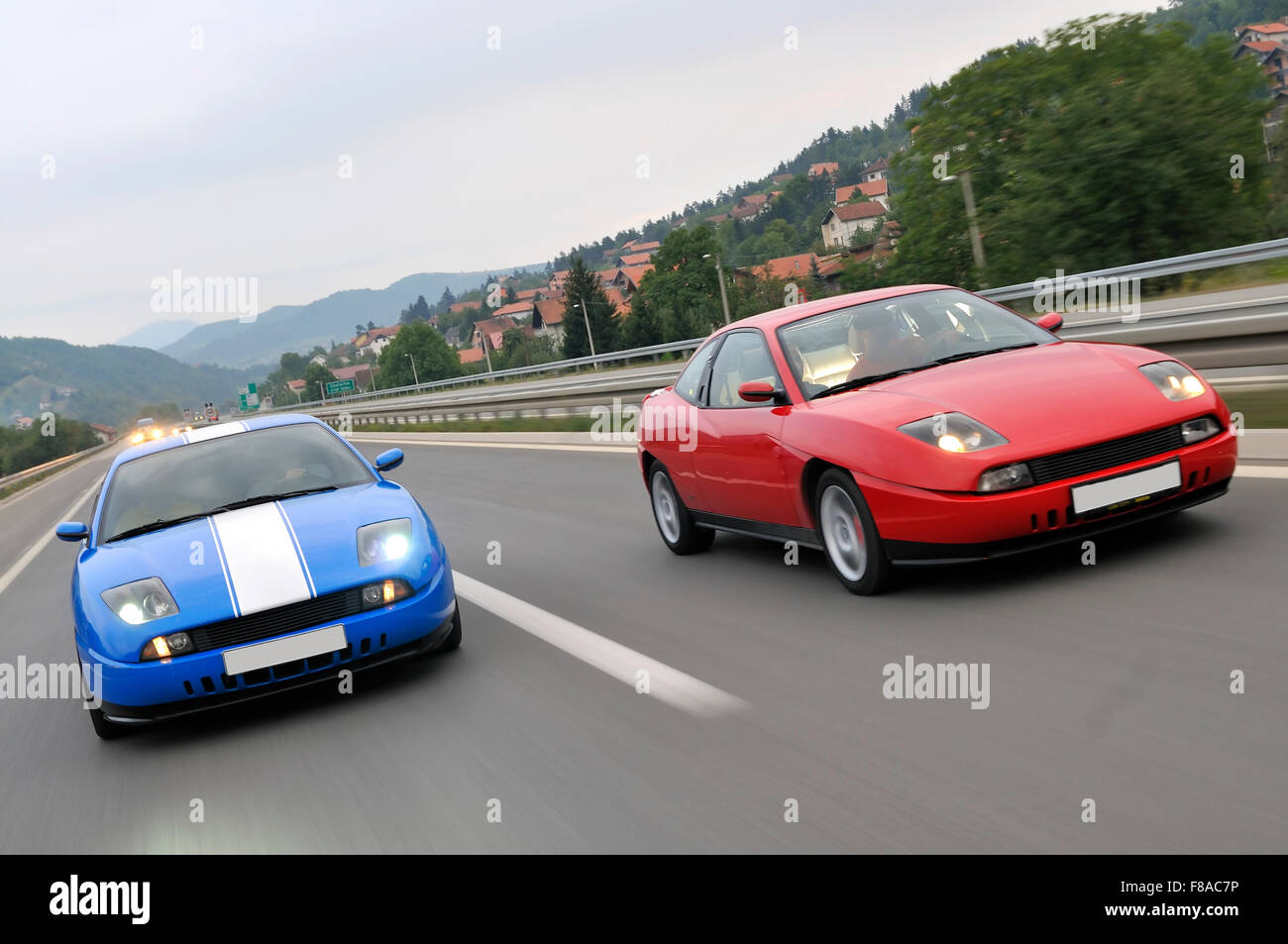 Two hot tuning cars racing Stock Photo - Alamy