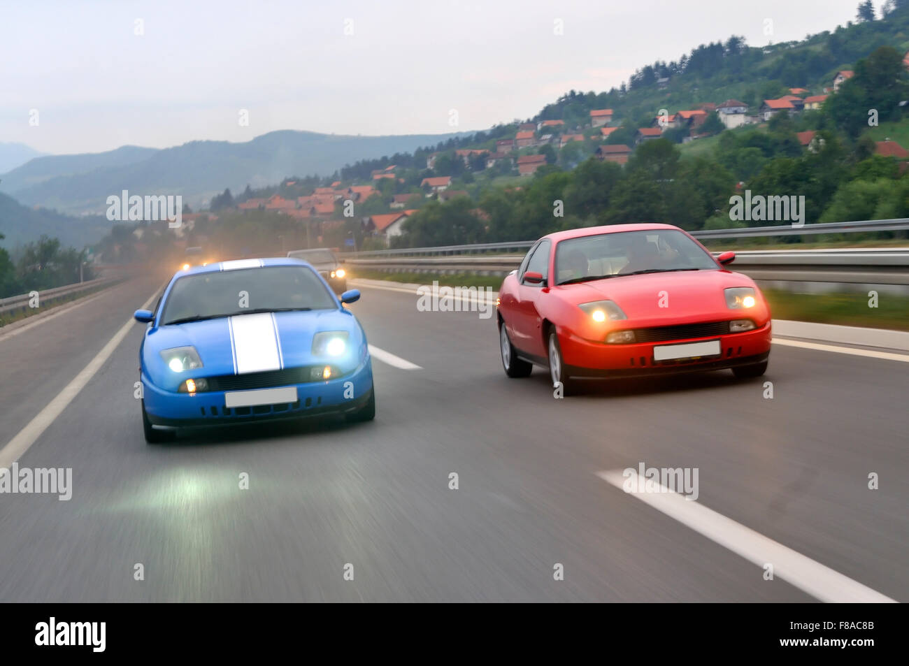 Two hot tuning cars racing Stock Photo - Alamy