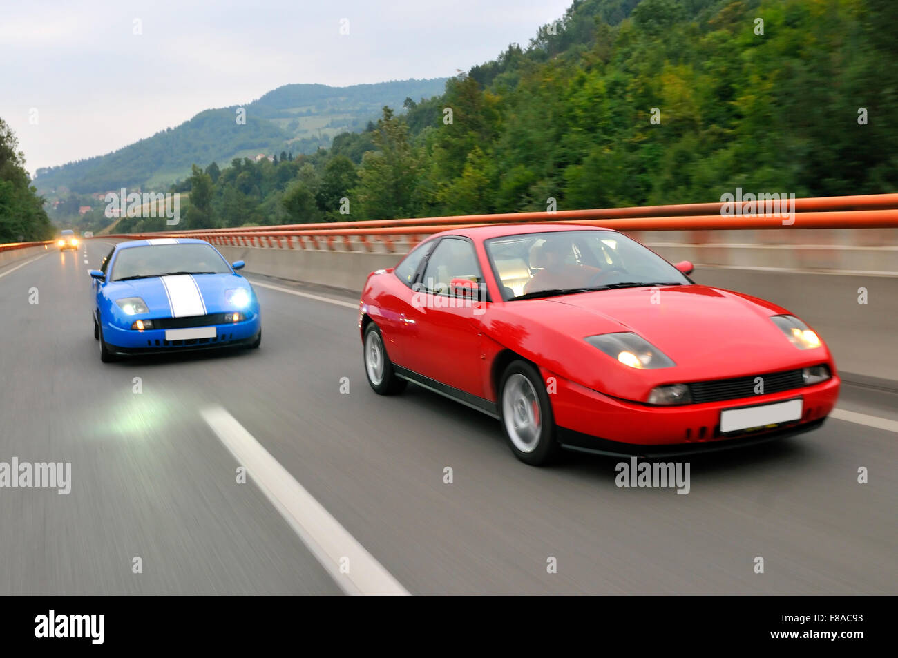 Two hot tuning cars racing Stock Photo - Alamy