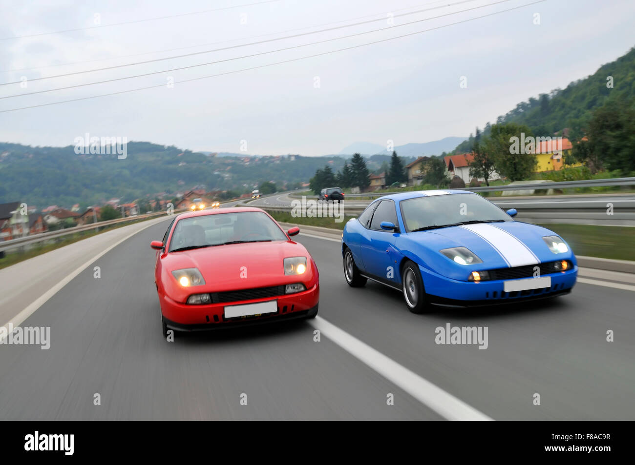 Two hot tuning cars racing Stock Photo - Alamy