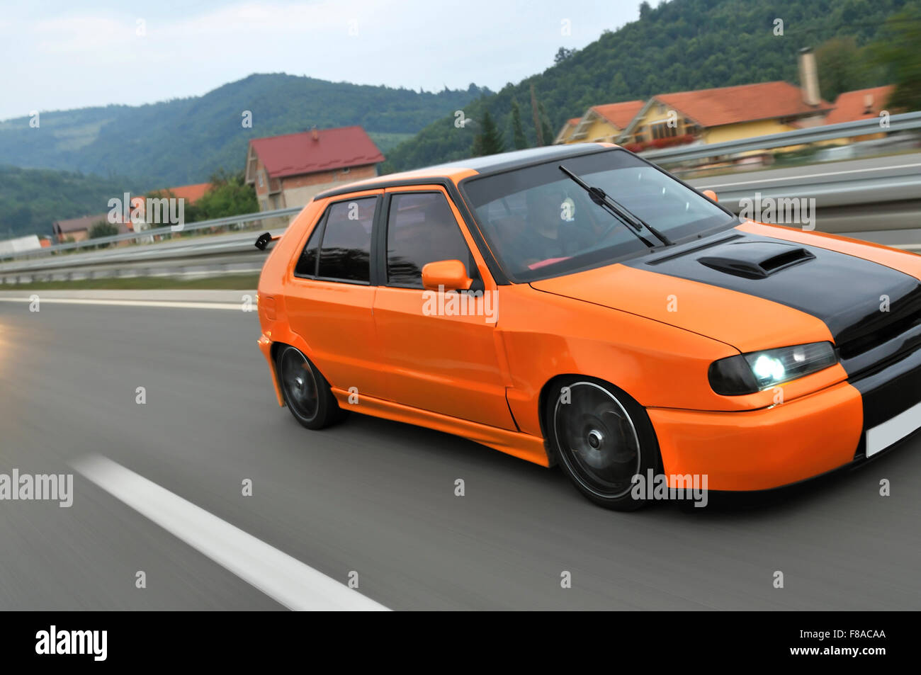 Blue sports car with white stripe hi-res stock photography and images ...