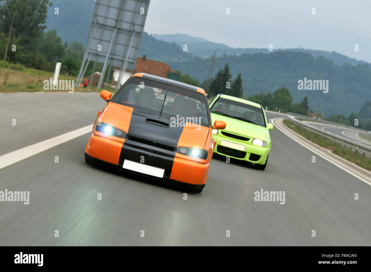 Fast tuning cars racing on the highway Stock Photo - Alamy