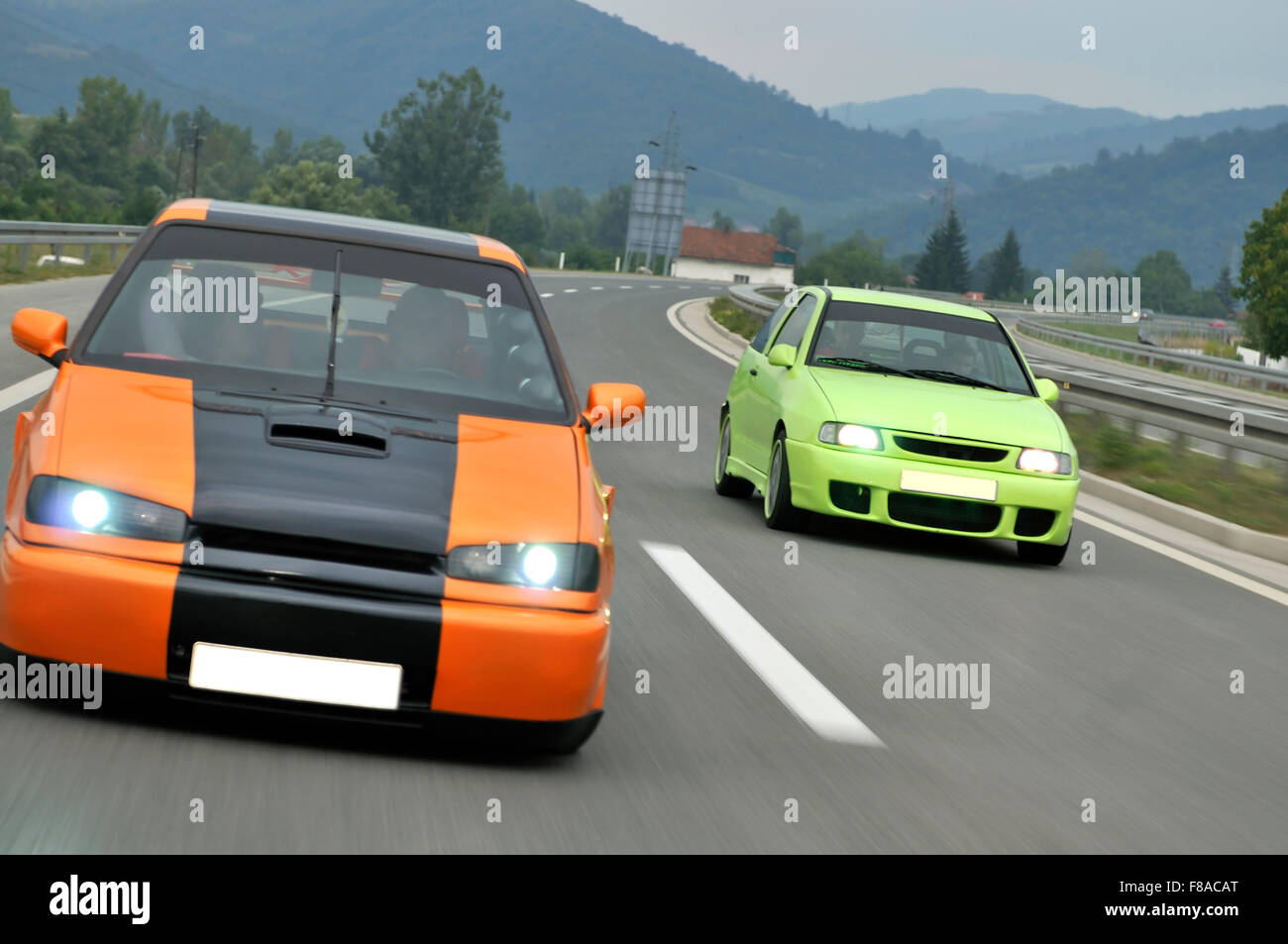 Fast tuning cars racing on the highway Stock Photo - Alamy