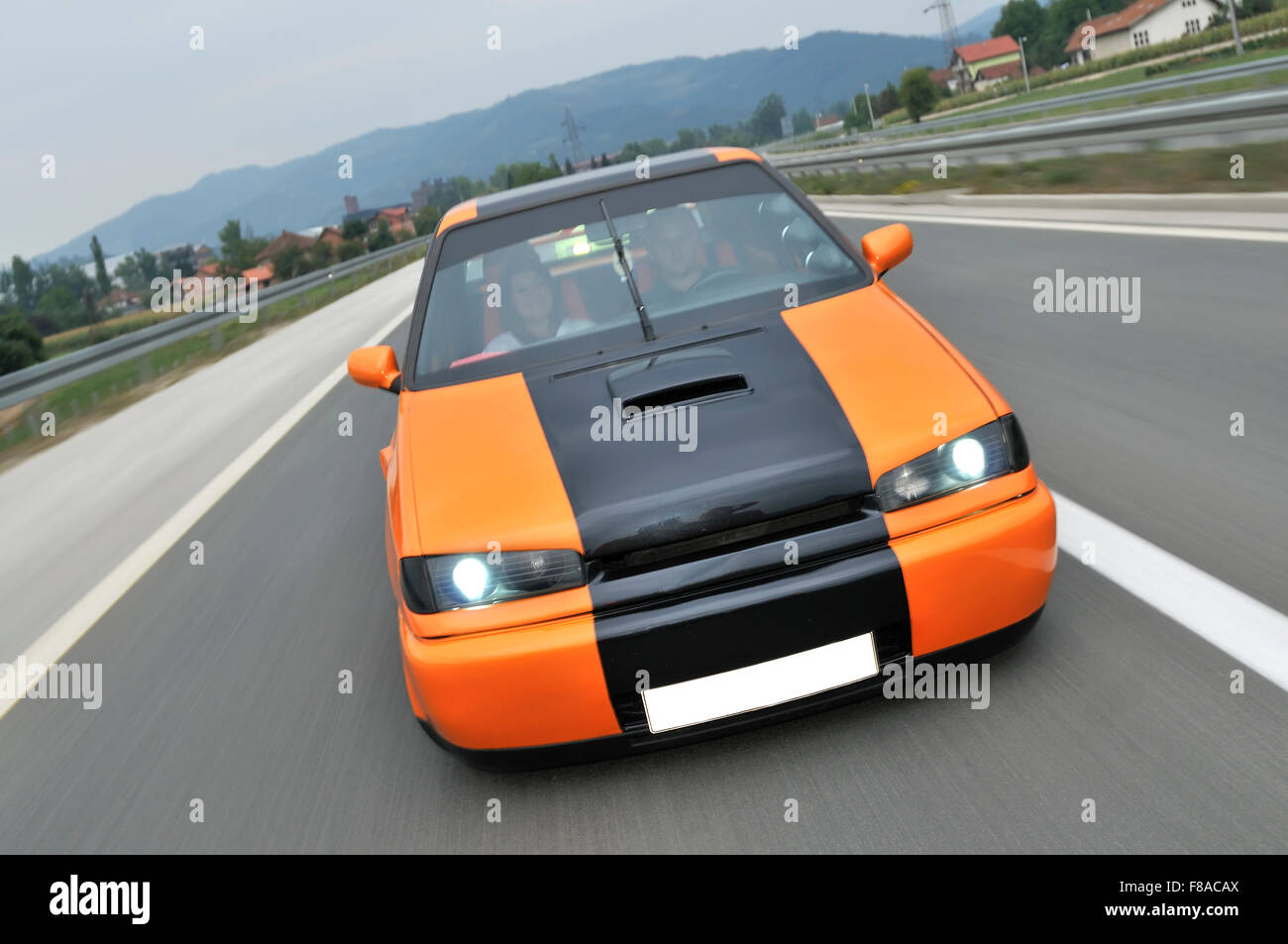 Picutre of tuning cars speeding on highway captured with long exposure ...