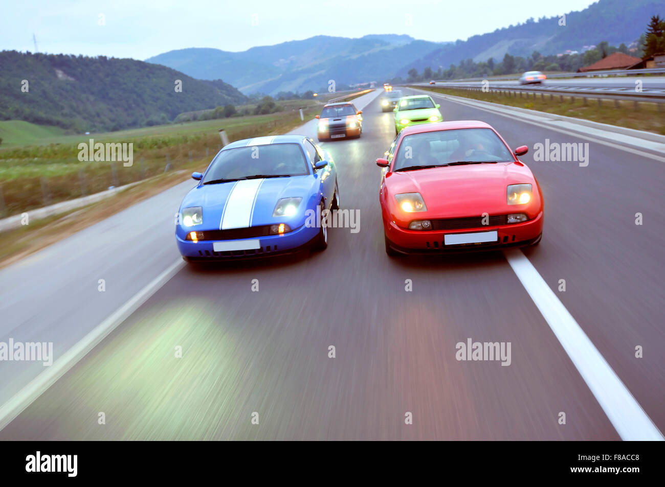 Two hot tuning cars racing Stock Photo - Alamy