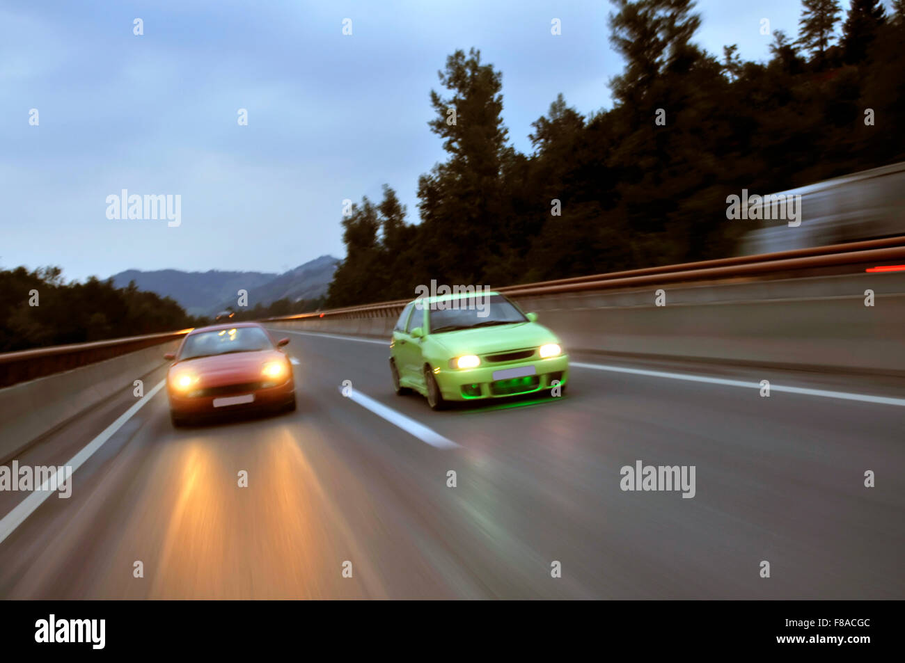 Fast tuning cars racing on the highway Stock Photo - Alamy