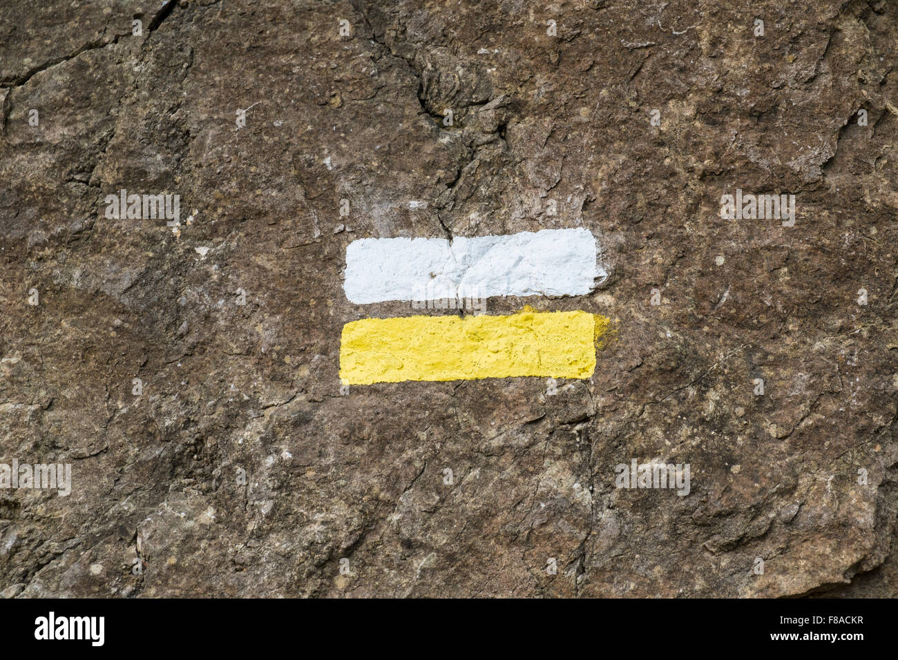 Sign painted on a rock to mark the way for hikers Stock Photo - Alamy