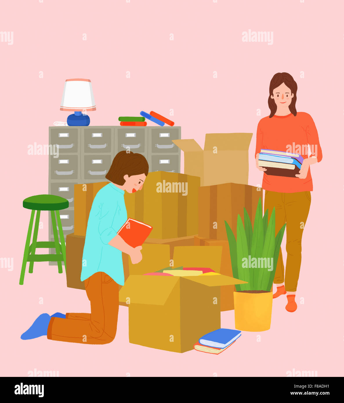 Man and woman packing moving boxes Stock Photo - Alamy