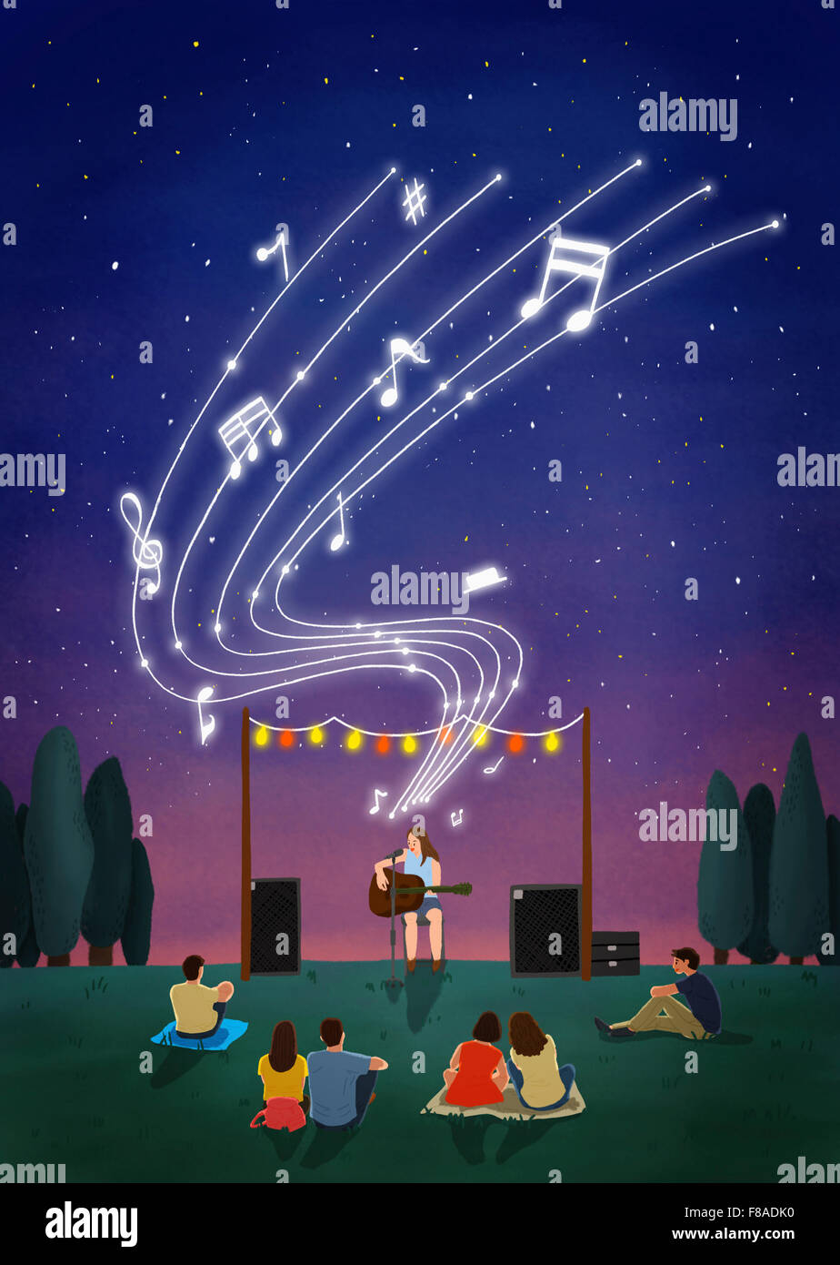 People sitting and watching a singer playing the guitar on greengrass ...