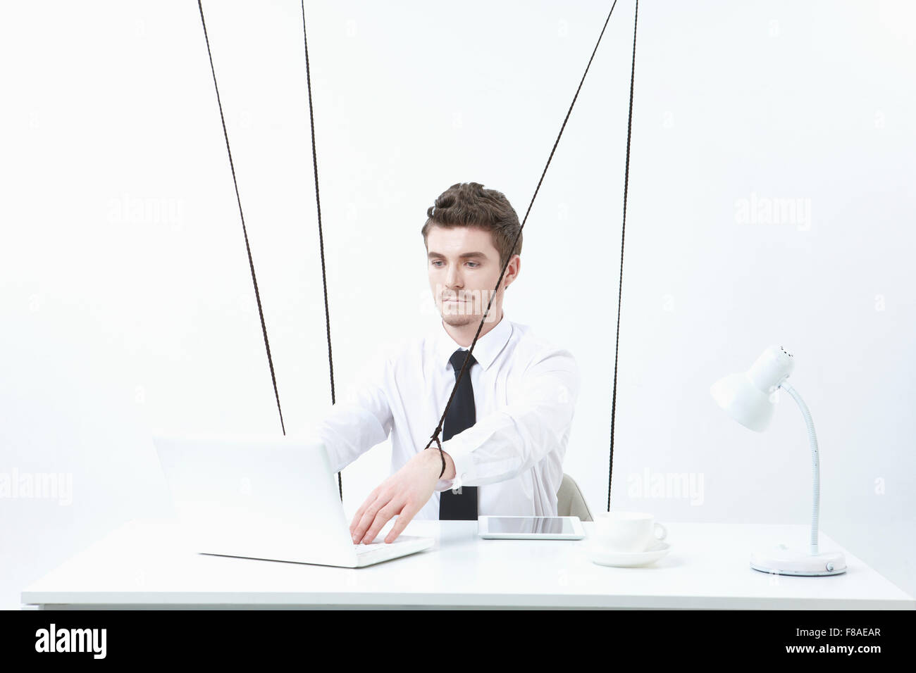 Puppet string man hi-res stock photography and images - Alamy