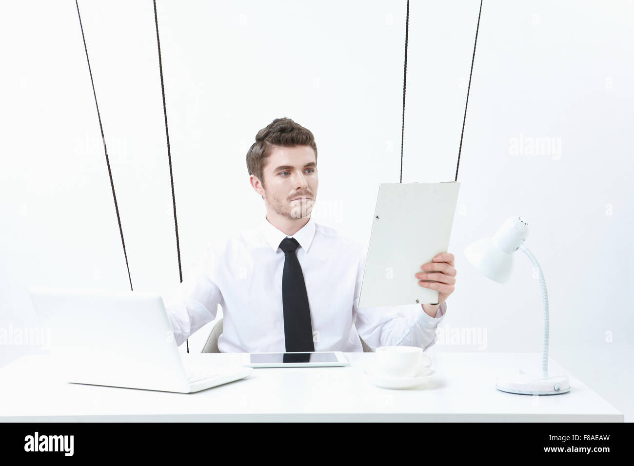 Business man holding a file Stock Photo - Alamy