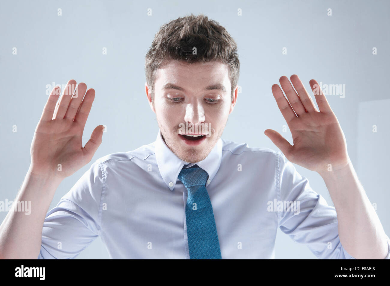 Man looking down through the window Stock Photo - Alamy