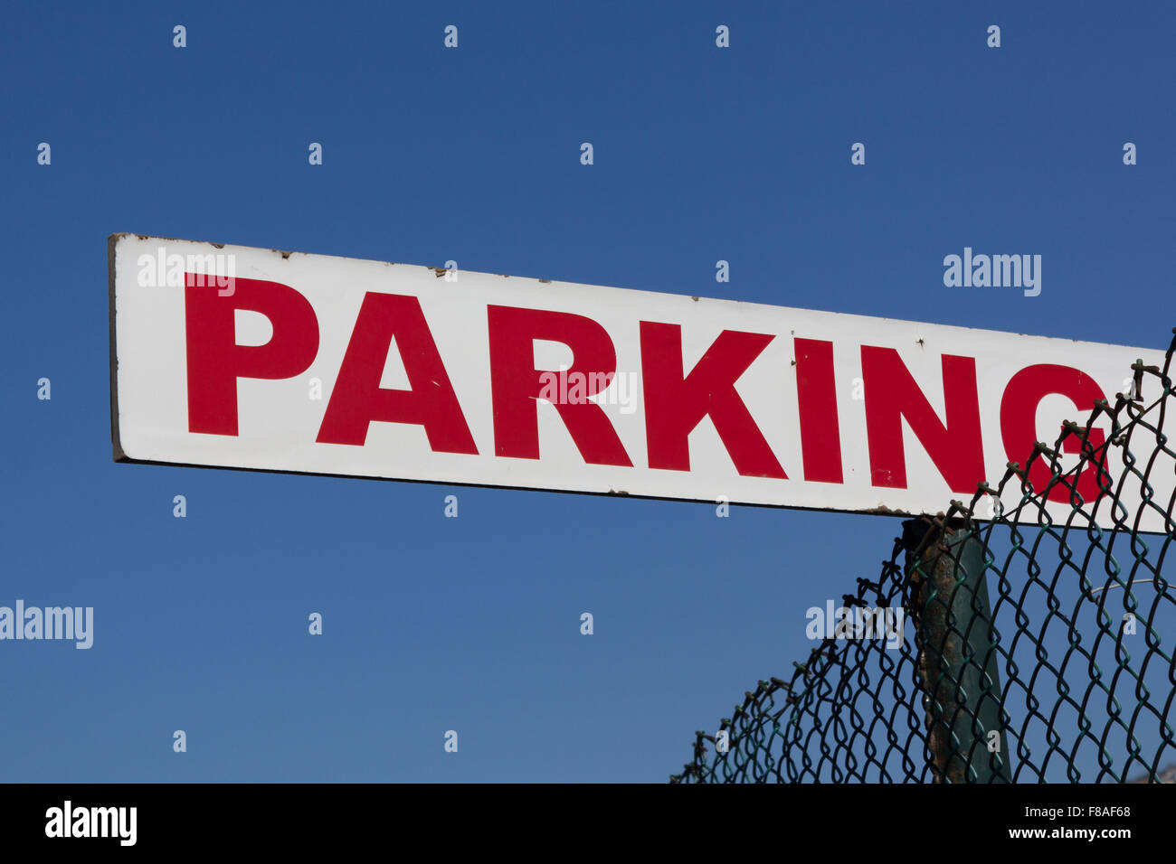 red parking sign on blue sky - parking place Stock Photo - Alamy