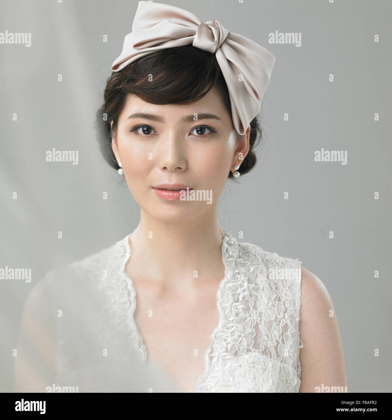 Woman in wedding dress staring forward Stock Photo - Alamy