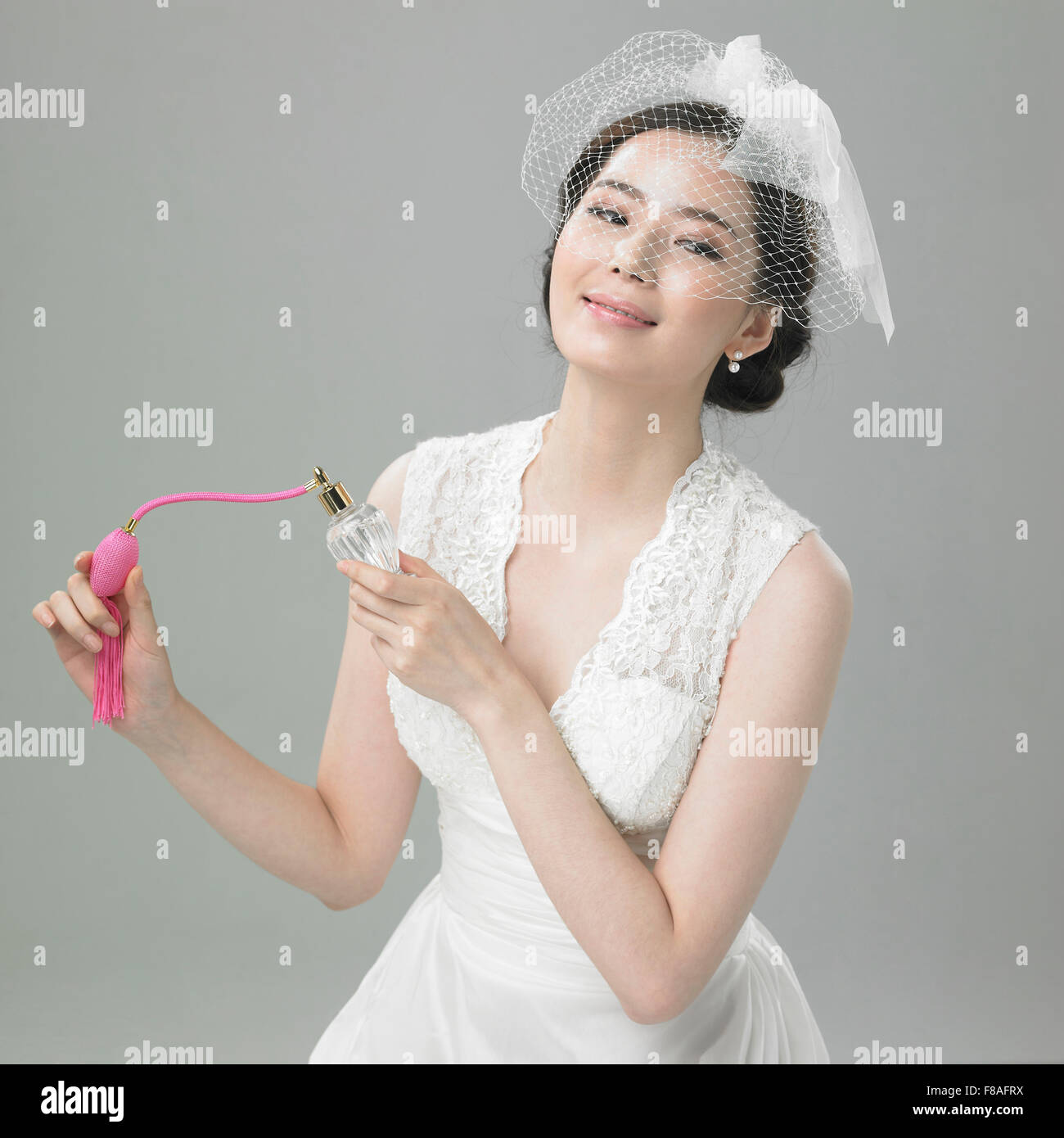 Korean bride wearing perfume Stock Photo - Alamy