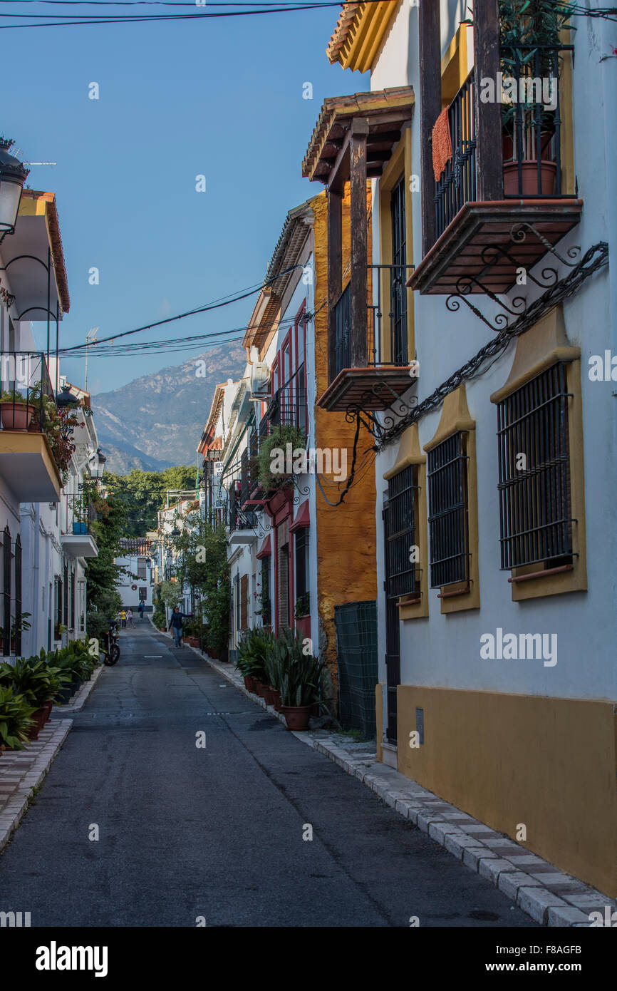 Pleasantly lit back street in Old Marbella in Spain with typical ...