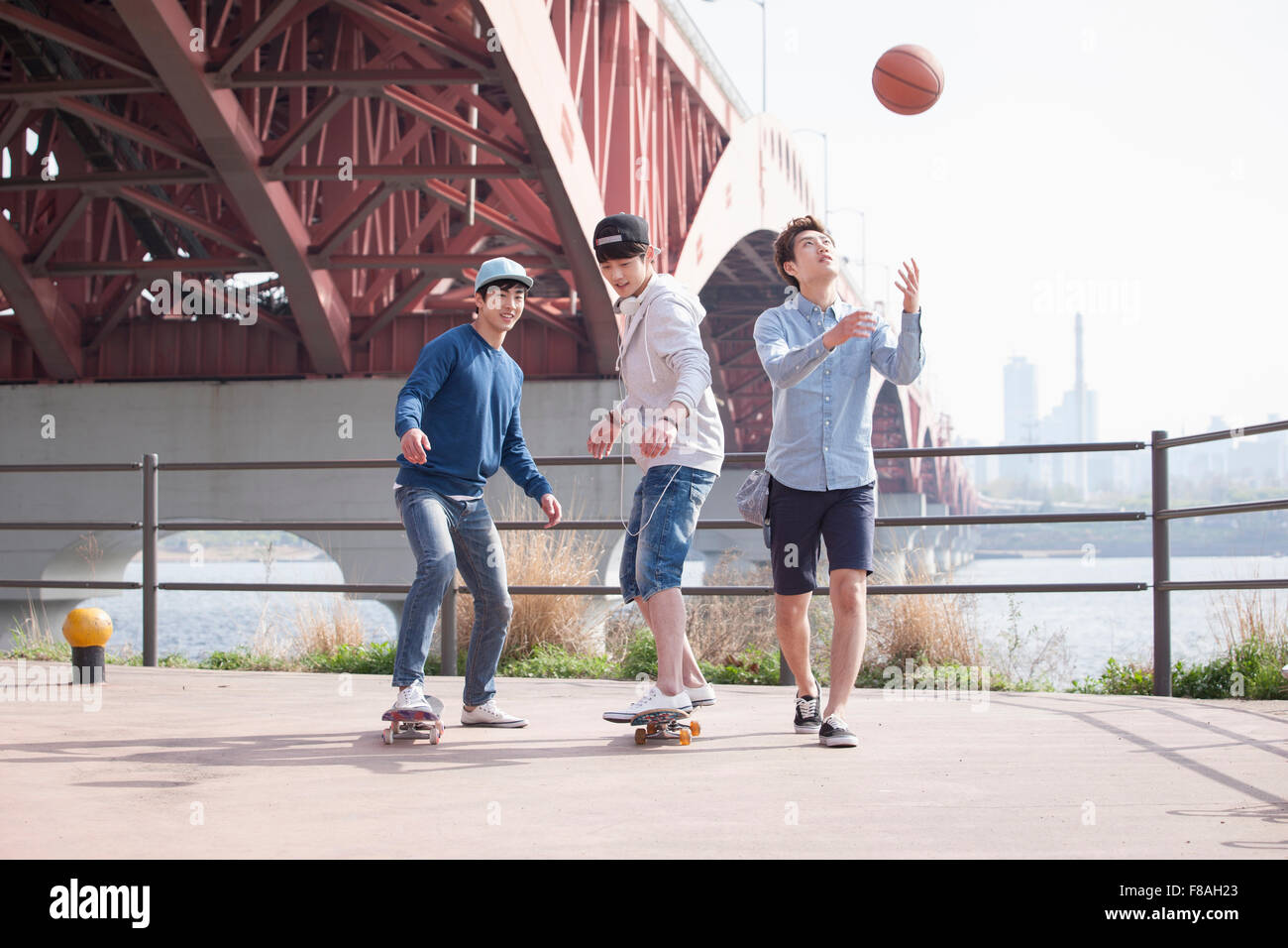 Three men having fun at the park Stock Photo - Alamy