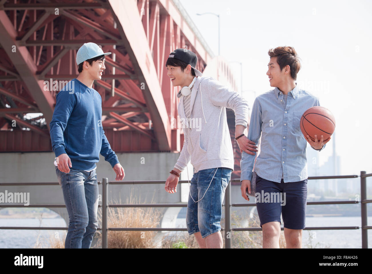 Three men having fun at the park Stock Photo - Alamy