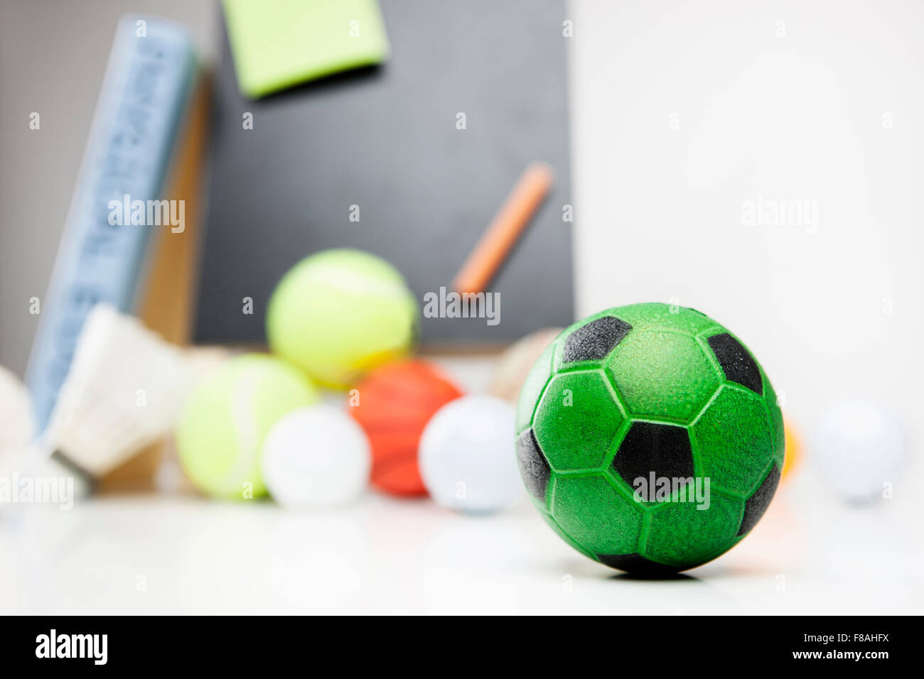 Green soccer ball in out-focused effect with the background of ...