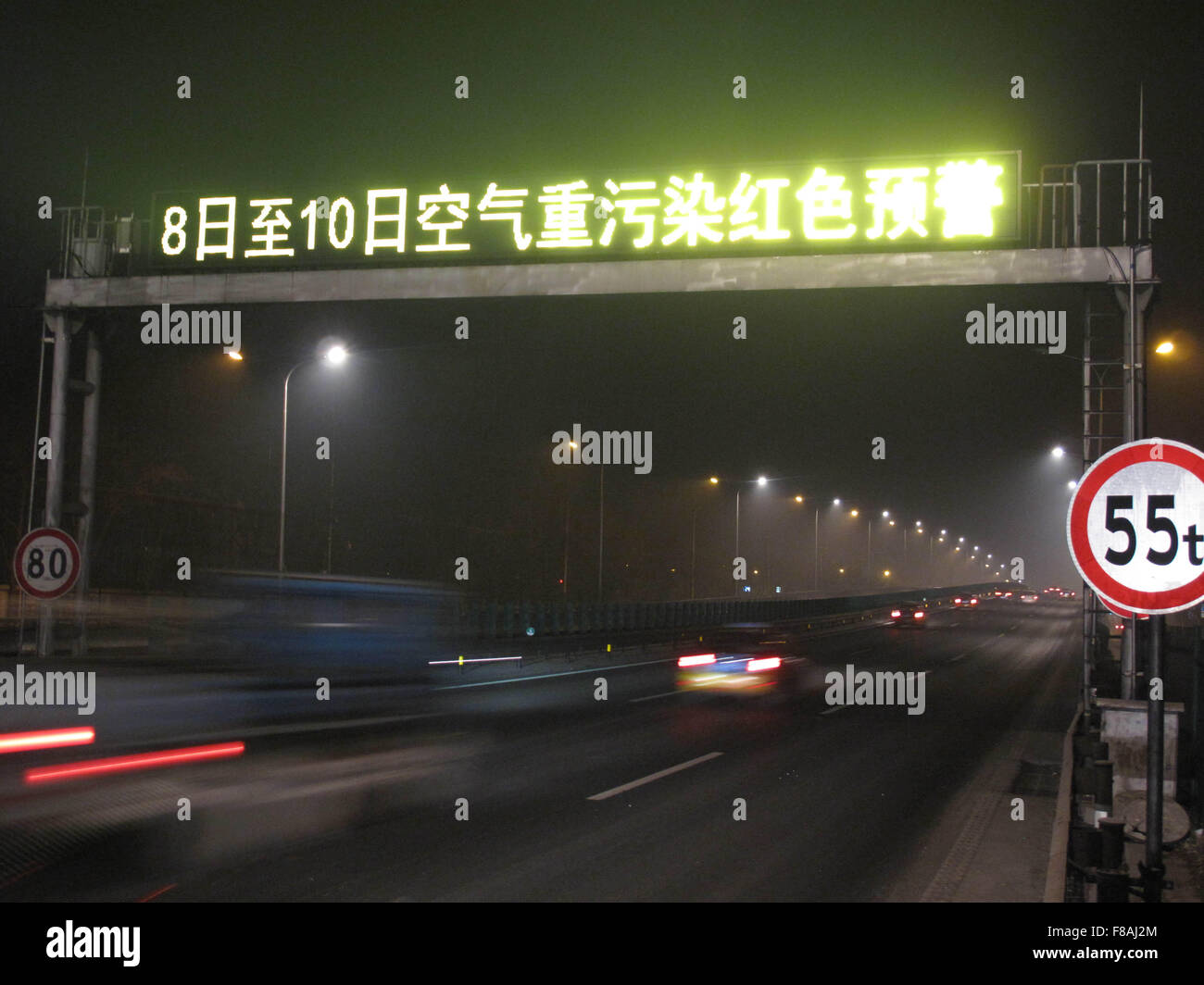 Beijing, China. 08th Dec, 2015. An electronic road sign reminds a red ...