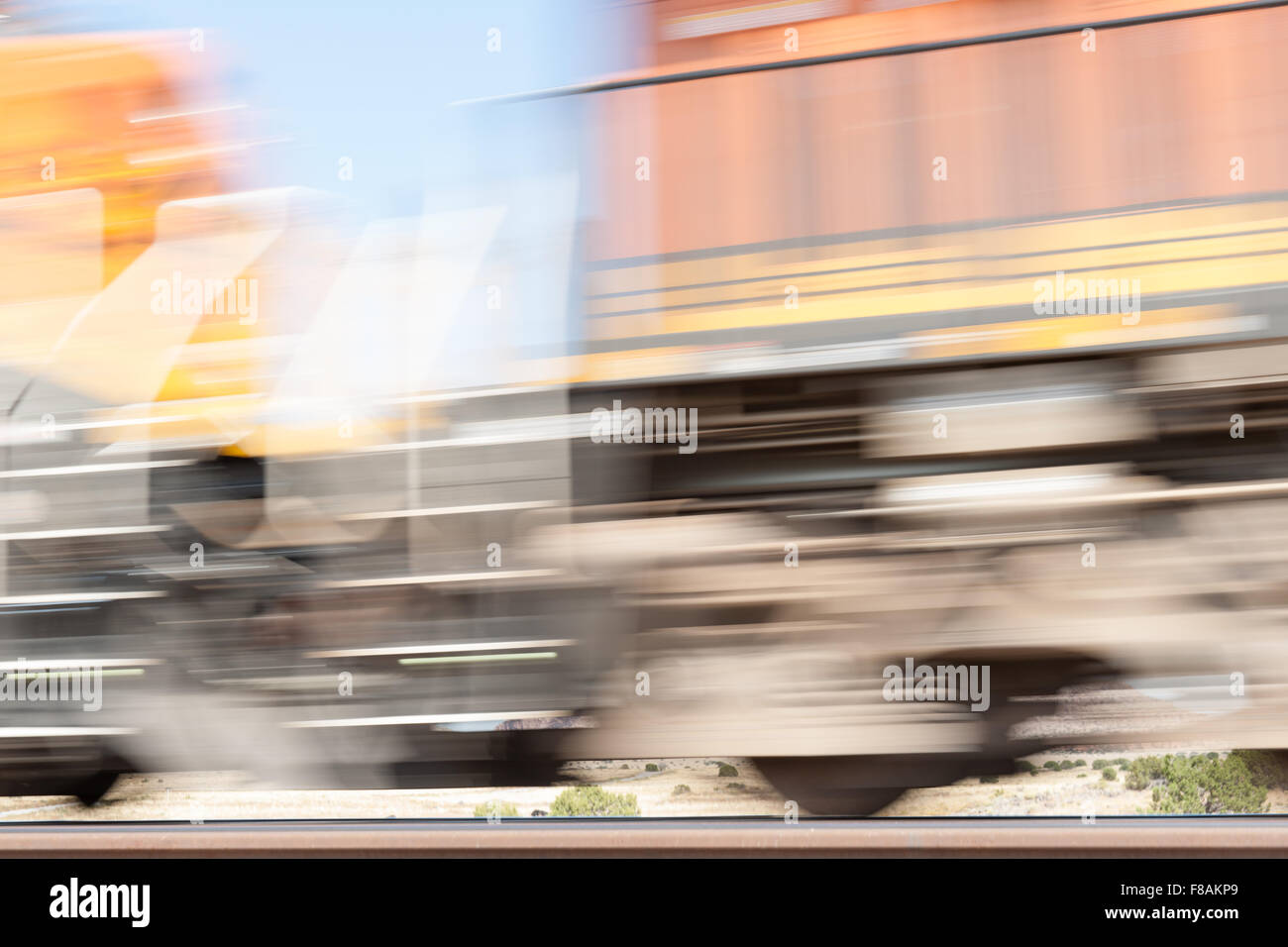 Freight train passing at speed, motion blur industrial and background ...