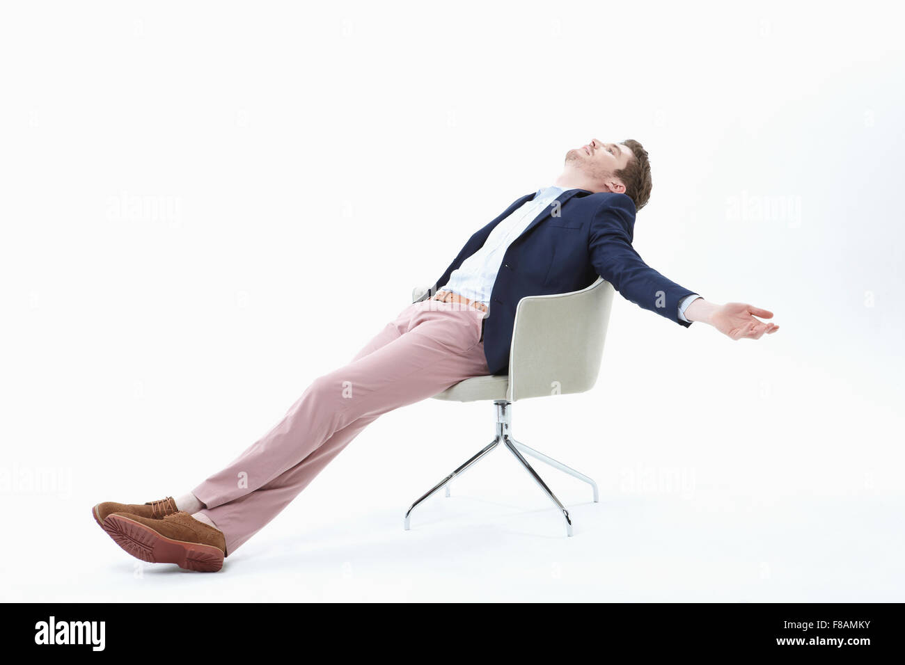 Businessman sitting and relaxing on chair, opening his arms with closed ...