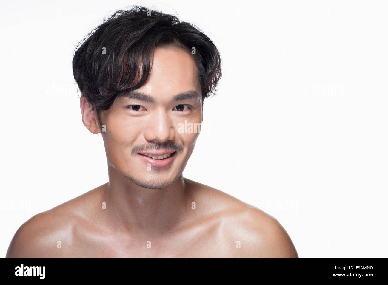 Portrait of smiling Asian man Stock Photo - Alamy