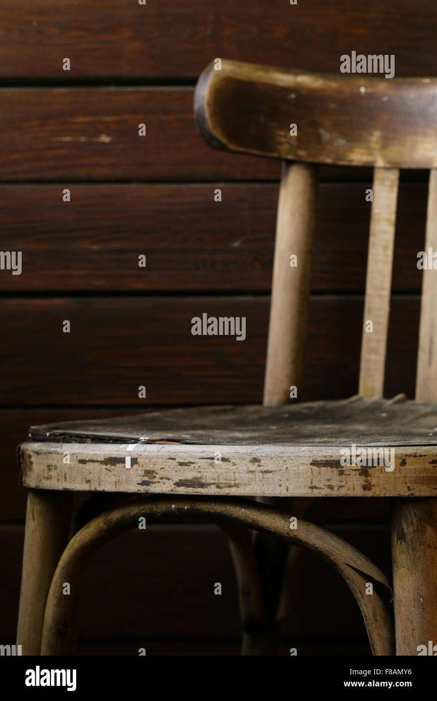 Old grunge vintage chair on a wooden background Stock Photo - Alamy