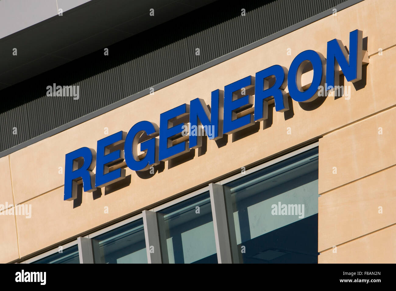 A logo sign outside of the headquarters of Regeneron Pharmaceuticals ...