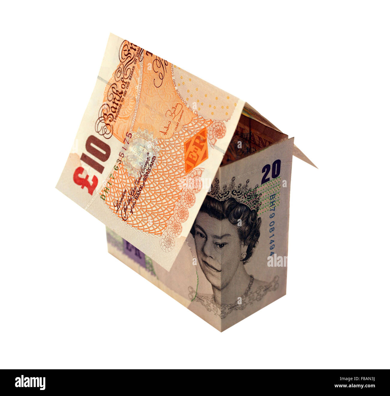 House made from bank notes on a white background Stock Photo - Alamy