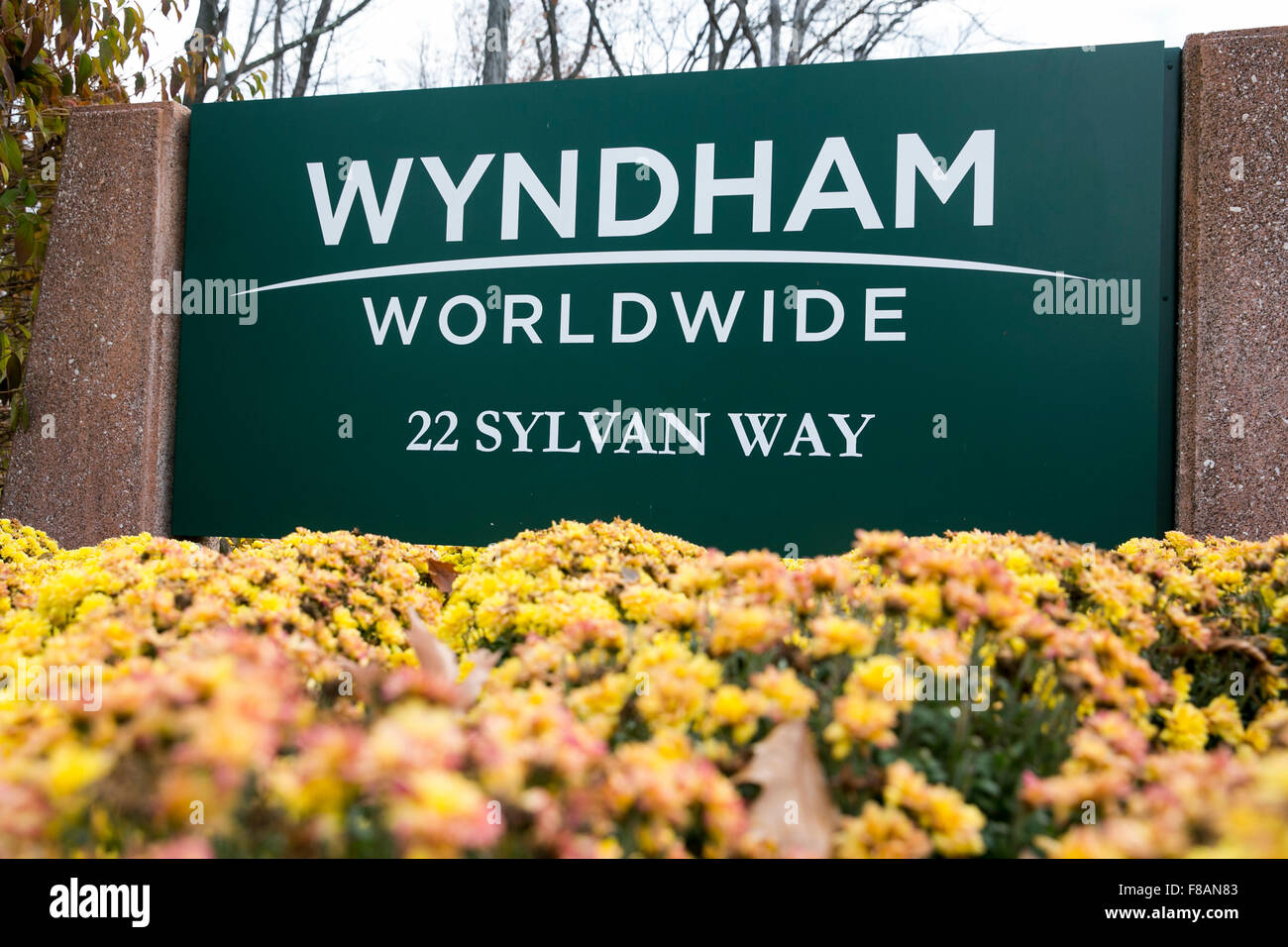 A logo sign outside of the headquarters of the hotel operator Wyndham ...