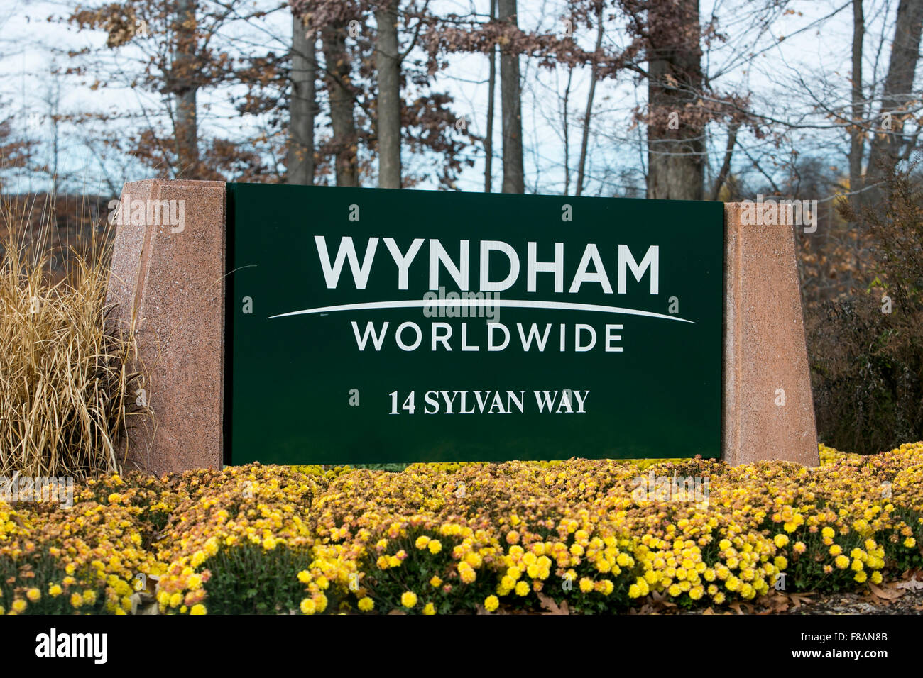 A logo sign outside of the headquarters of the hotel operator Wyndham ...