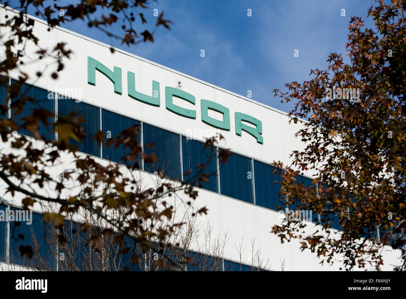 A logo sign outside of the headquarters of the Nucor Corporation in ...