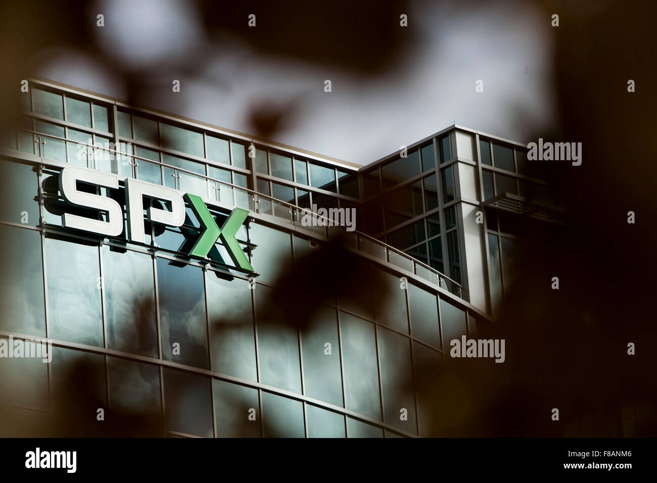 A logo sign outside of the headquarters of the SPX Corporation in ...