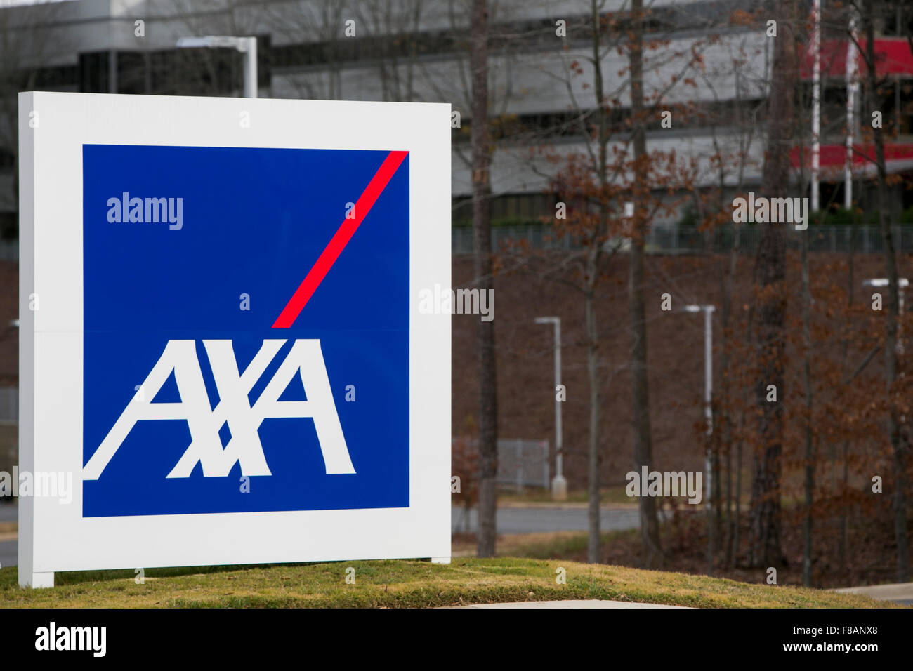 A logo sign outside of a facility occupied by the AXA Group in ...