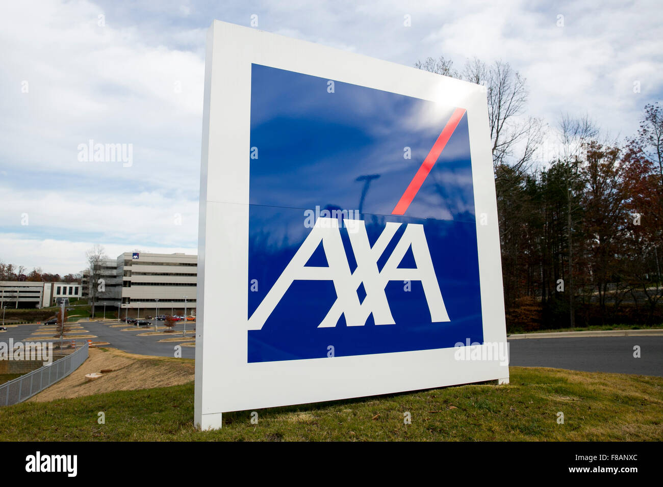 A logo sign outside of a facility occupied by the AXA Group in ...