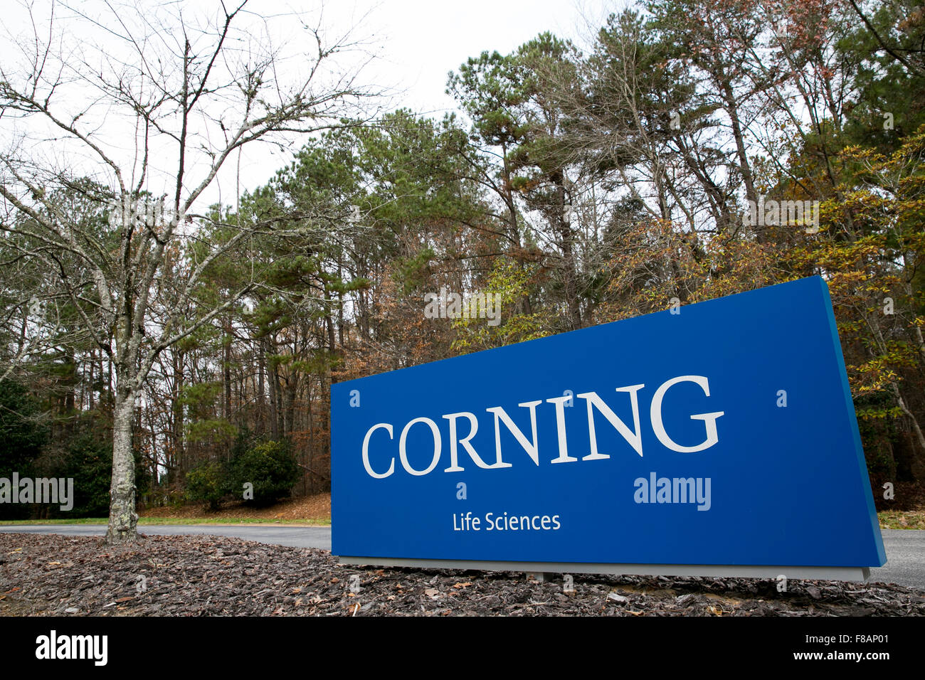 A logo sign outside of a facility occupied by Corning Life Sciences in ...