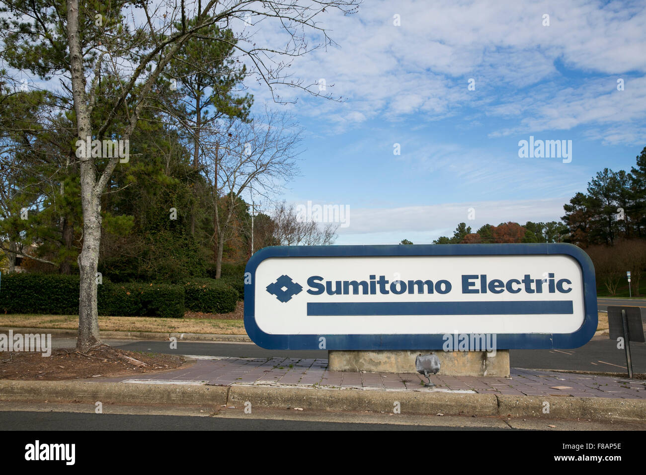 A logo sign outside of a facility occupied by Sumitomo Electric ...