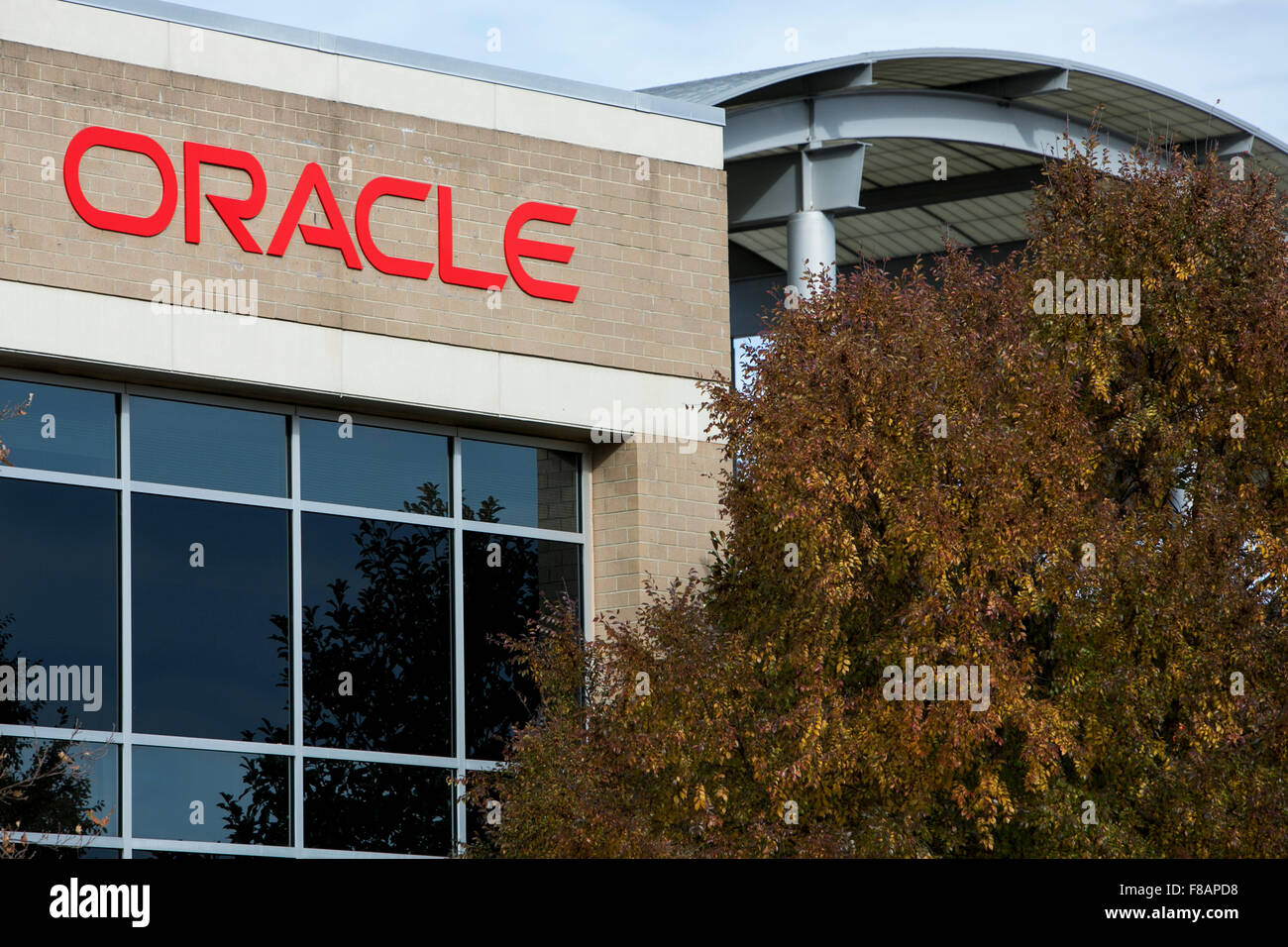 A logo sign outside of a facility occupied by The Oracle Corporation in ...