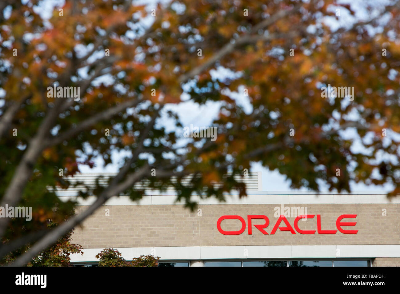 A logo sign outside of a facility occupied by The Oracle Corporation in ...