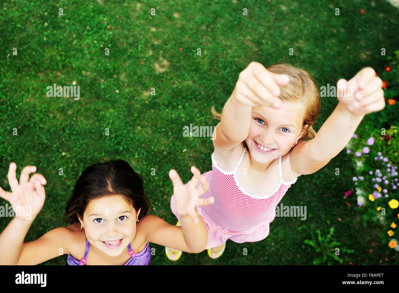 two happy young girls children have fun outdoor in nature Stock Photo ...