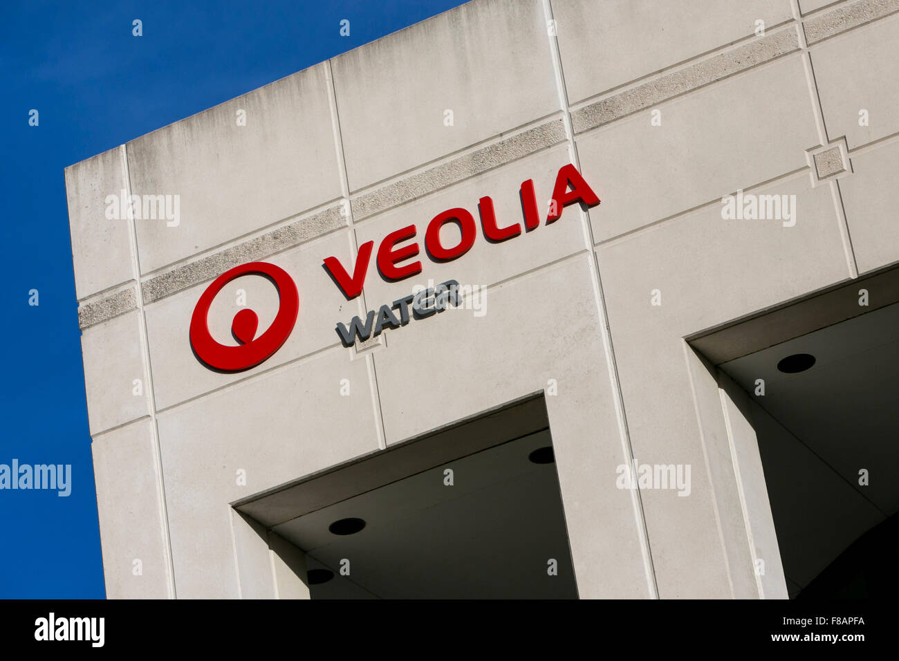 A logo sign outside of a facility occupied by Veolia Water in Cary ...
