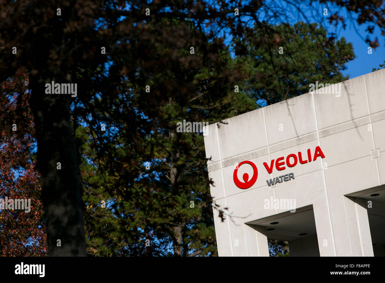 A logo sign outside of a facility occupied by Veolia Water in Cary ...