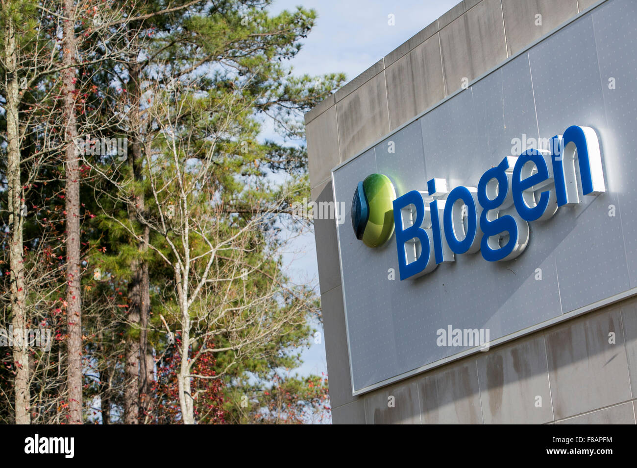 A logo sign outside of a facility occupied by Biogen in Research ...