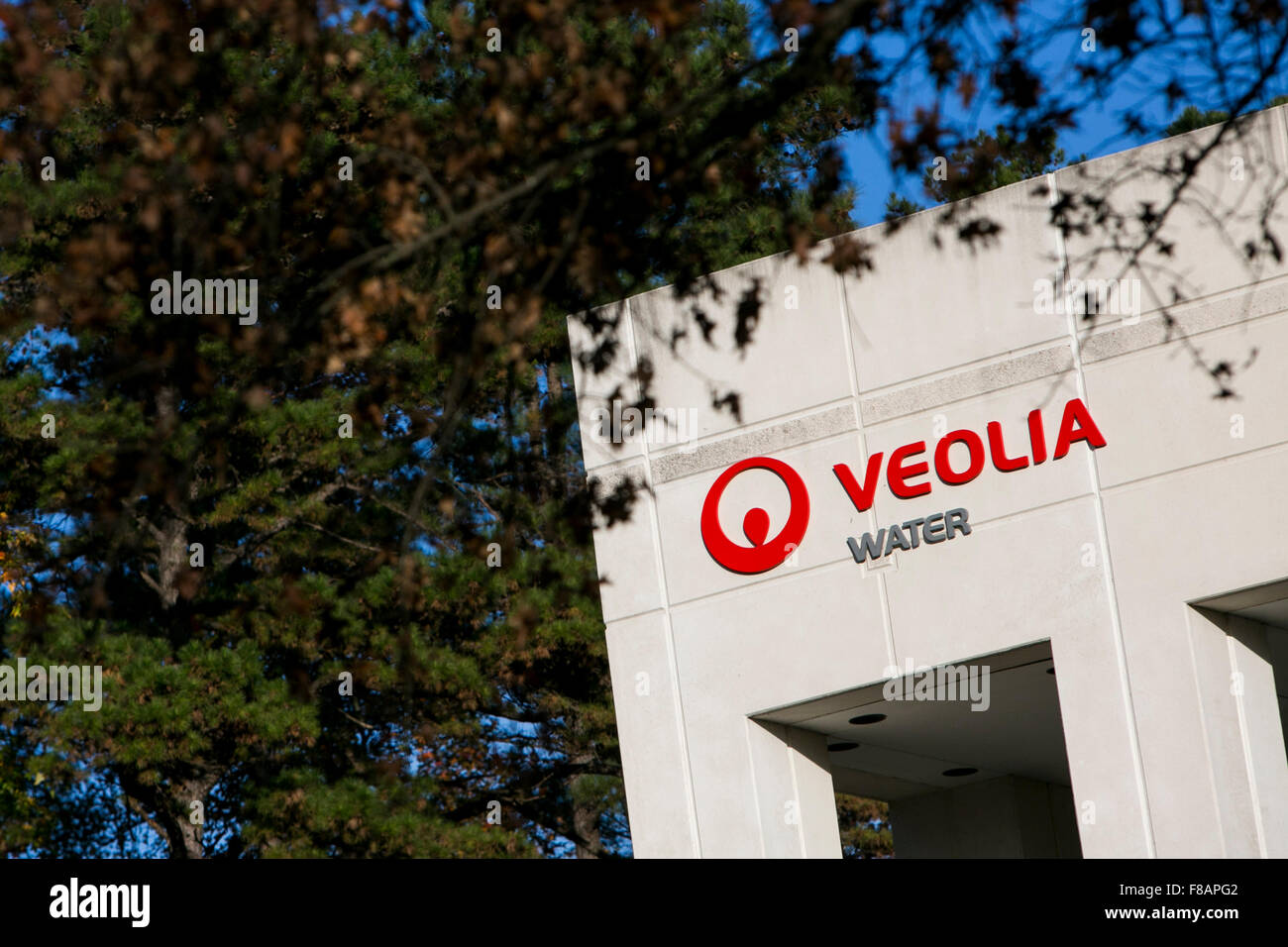 A logo sign outside of a facility occupied by Veolia Water in Cary ...